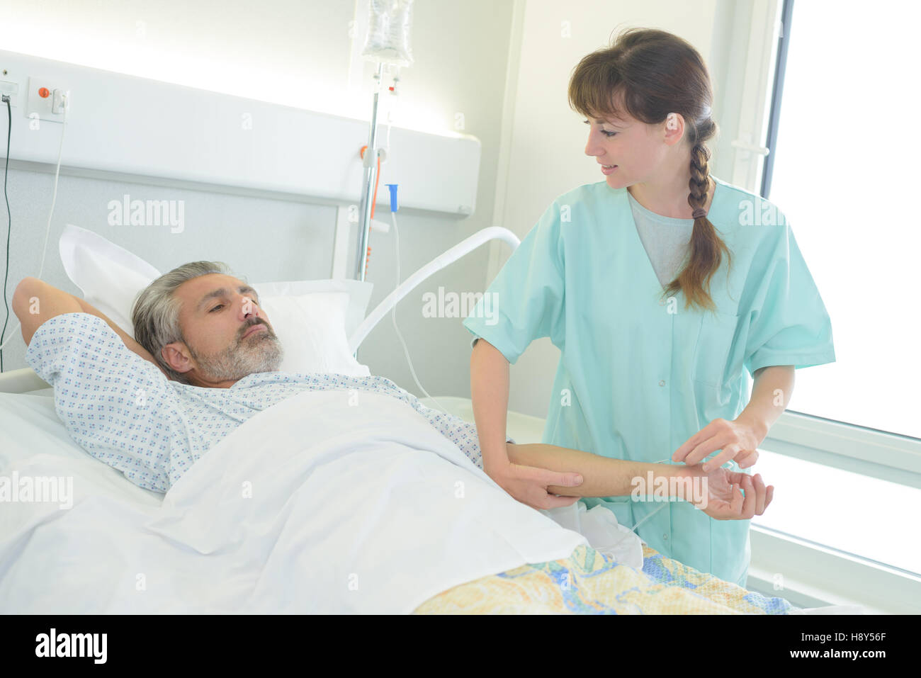 nurse checking on a patients Stock Photo - Alamy