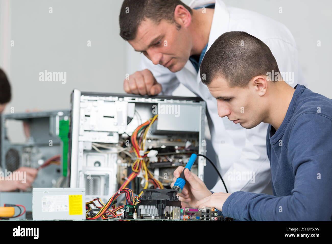 student and teacher in electrical engineering course Stock Photo - Alamy