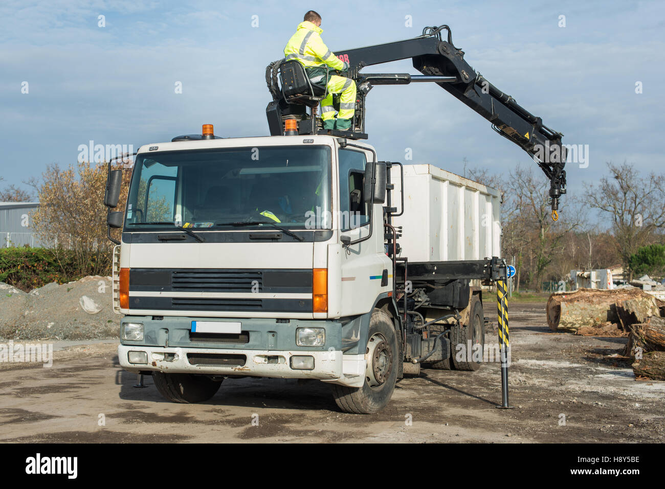 a man working on a lorry outdoors Stock Photo - Alamy
