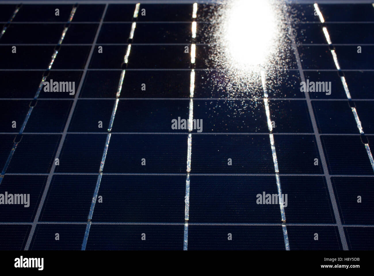 Solar panel with sun just starting to hit it Stock Photo - Alamy
