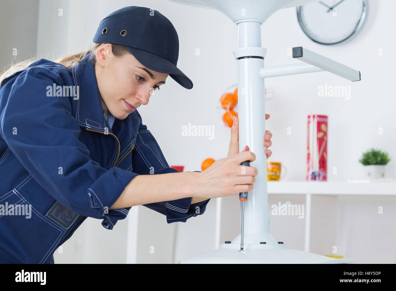 Female worker using screwdriver Stock Photo - Alamy