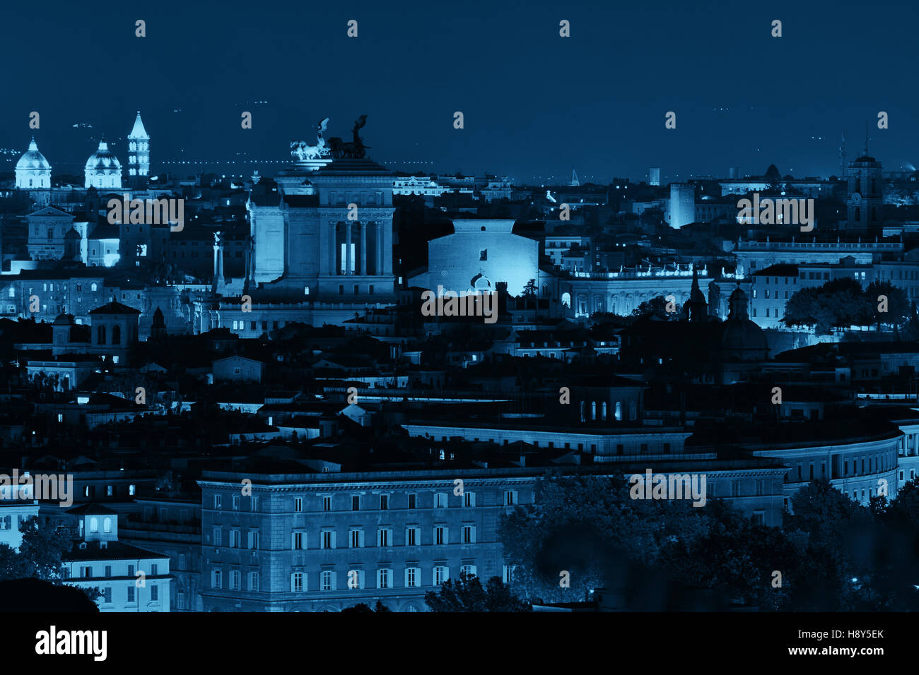 Rome rooftop view with ancient architecture in Italy at night in blue ...