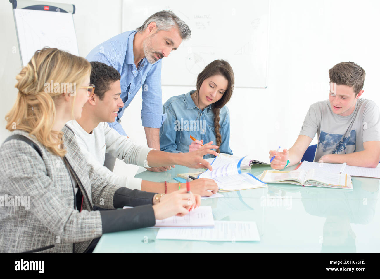 manager and stuff meeting in an office Stock Photo - Alamy