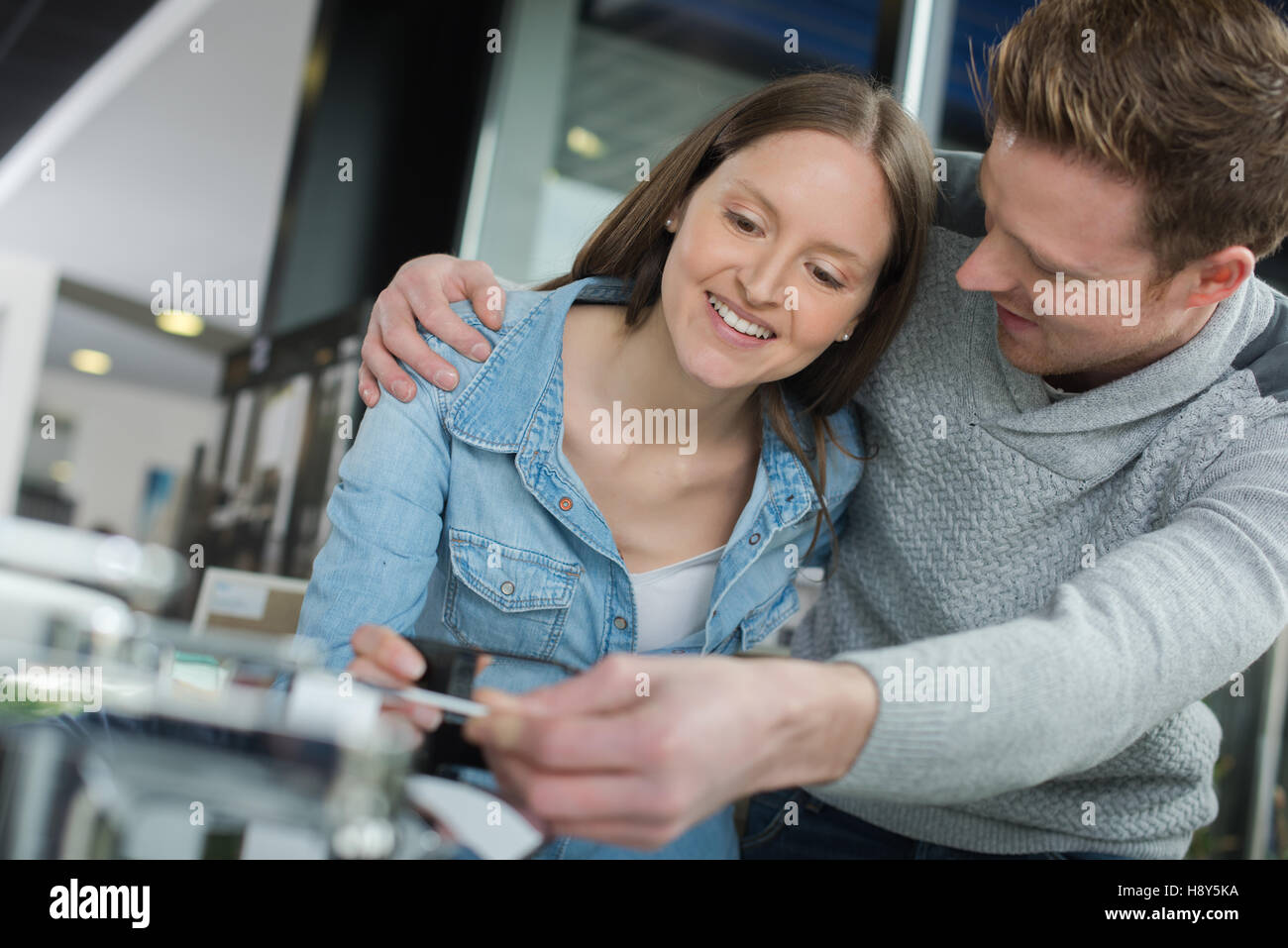 young couple fixing a devise at home Stock Photo - Alamy