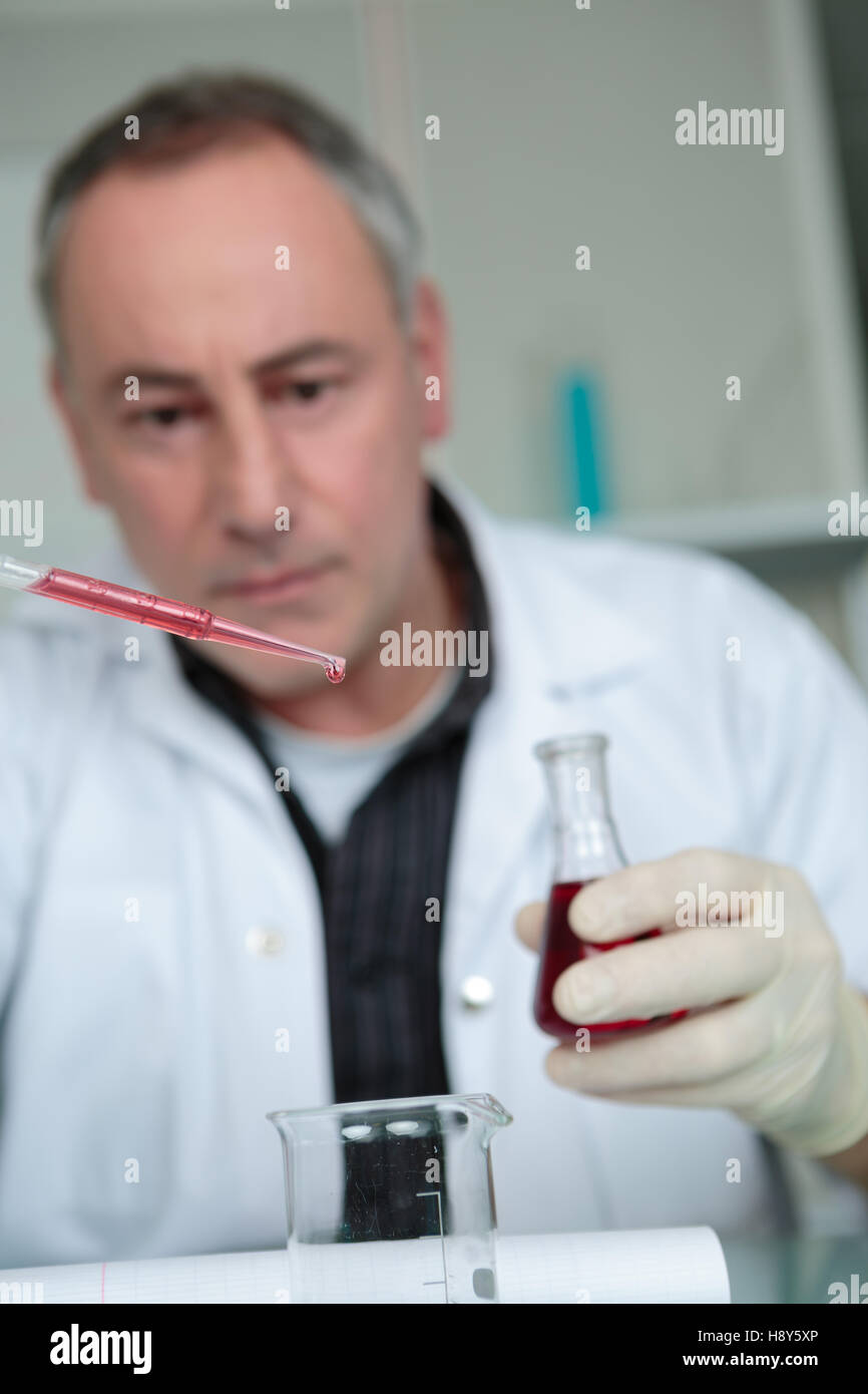 man in laboratory with pipette in the clinic research Stock Photo - Alamy