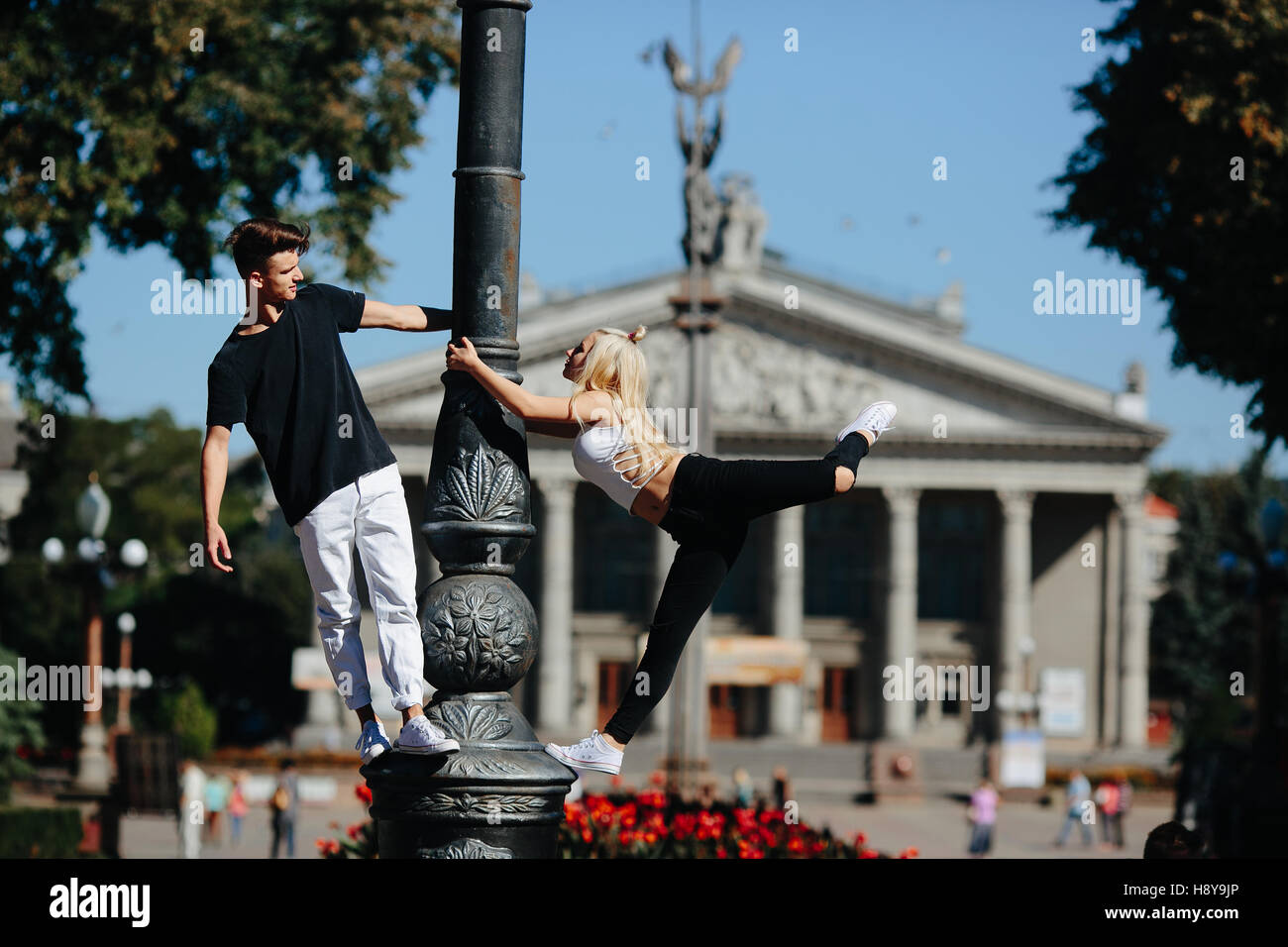 man and woman performing acrobatic tricks Stock Photo - Alamy