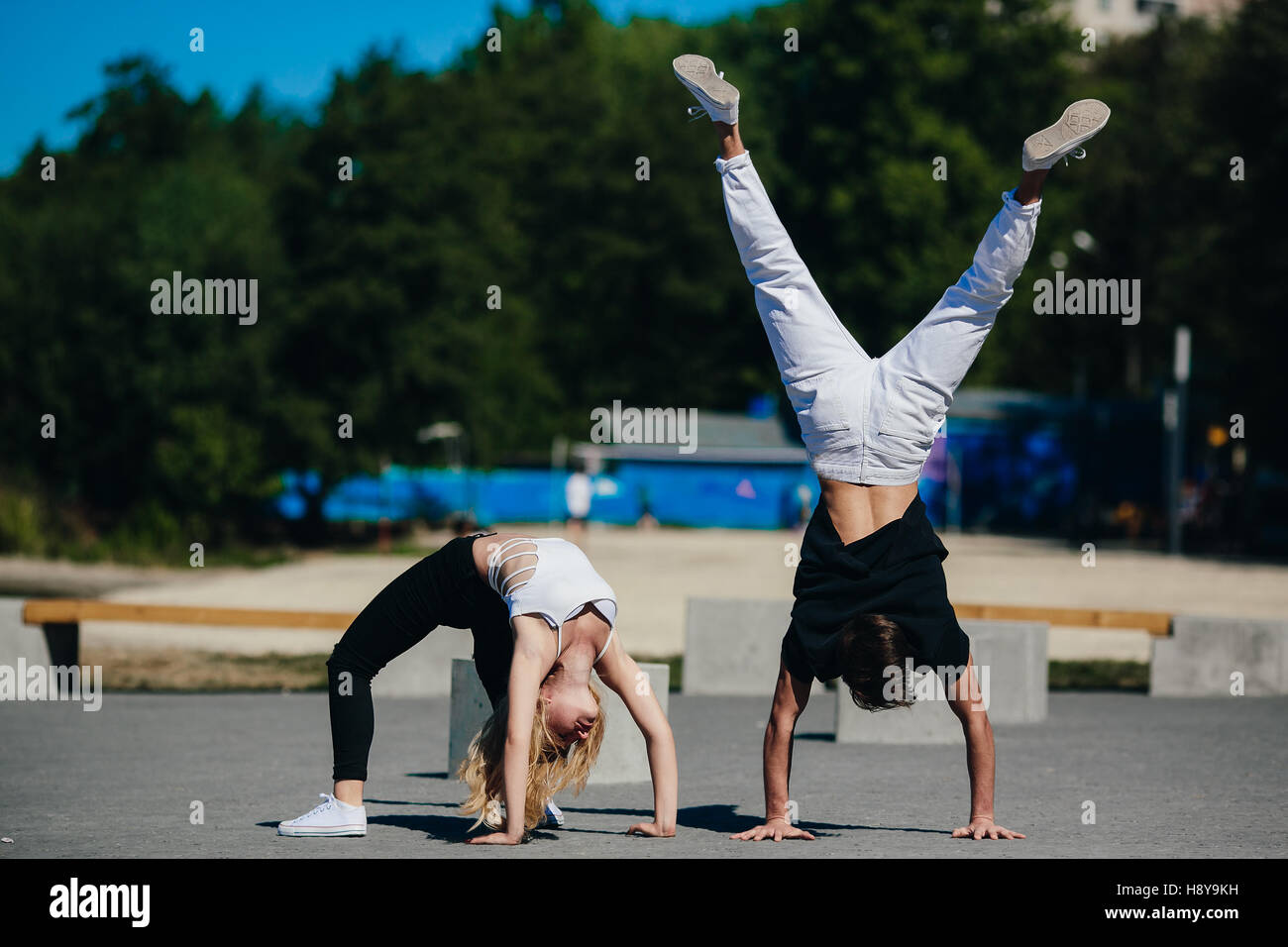 man and woman performing tricks Stock Photo - Alamy