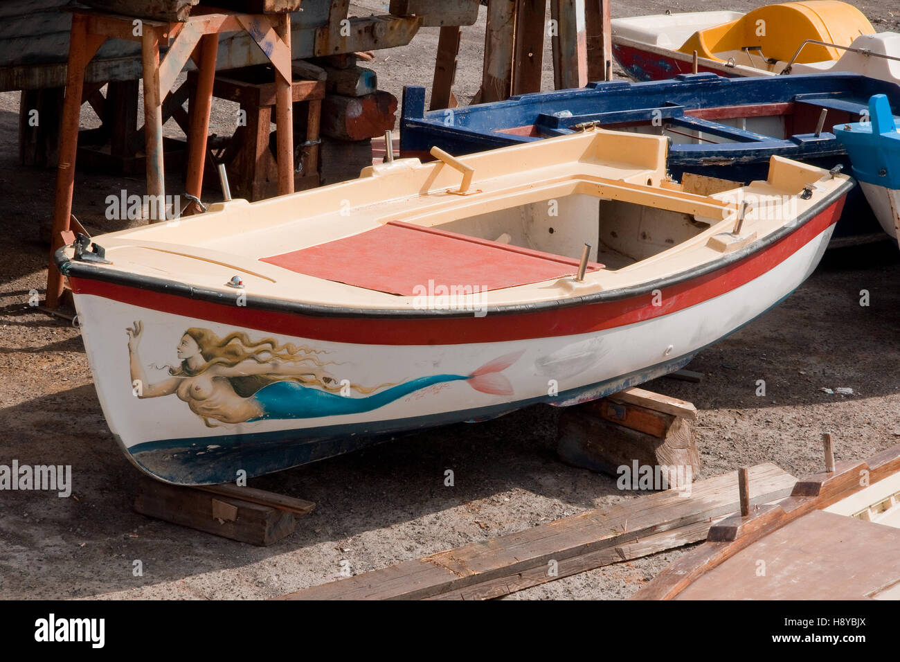 Fishing boat decorated with a Mermaid mural at Aci Trezza, Sicily Stock ...