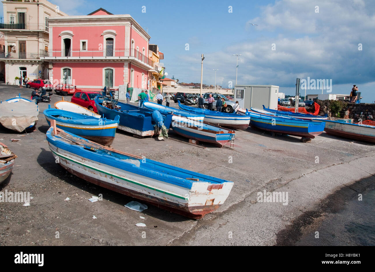 Traditional wooden Sicilian fishing boats on the slipway at Aci Trezza ...