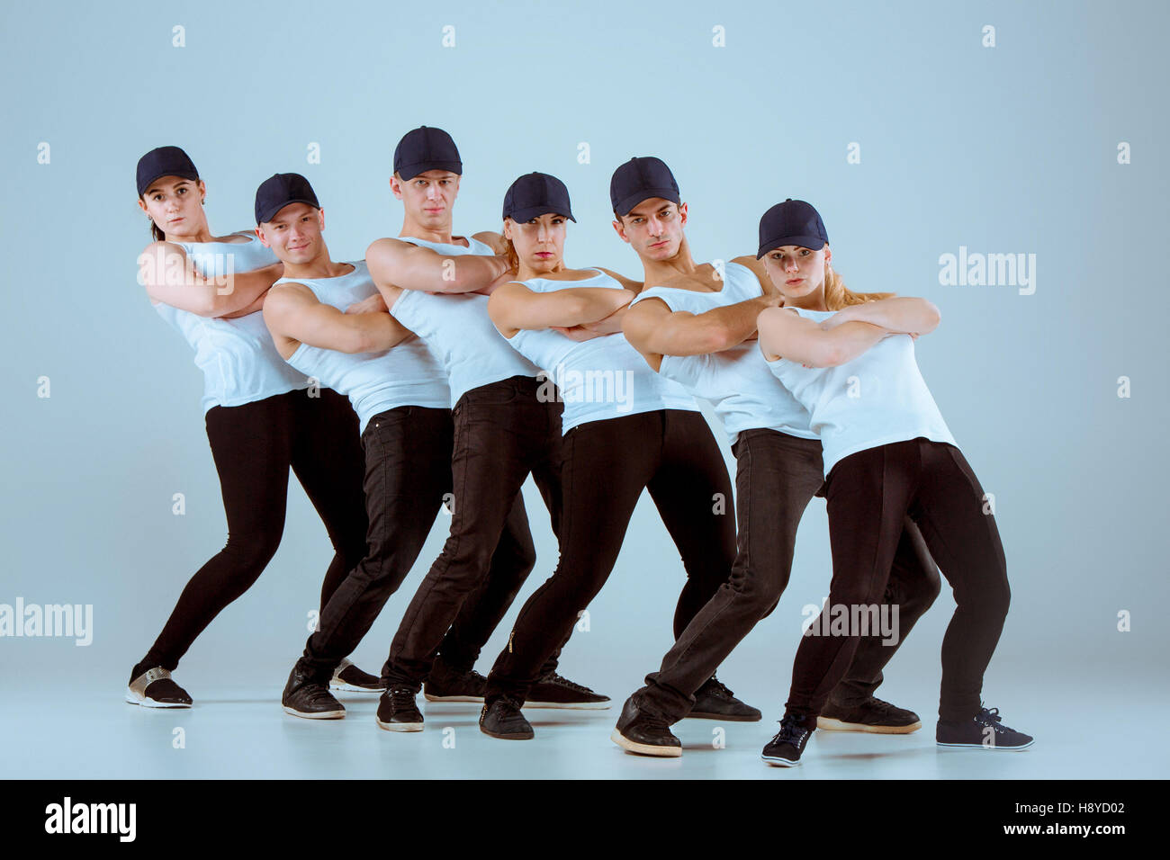 Group of men and women dancing hip hop choreography Stock Photo - Alamy