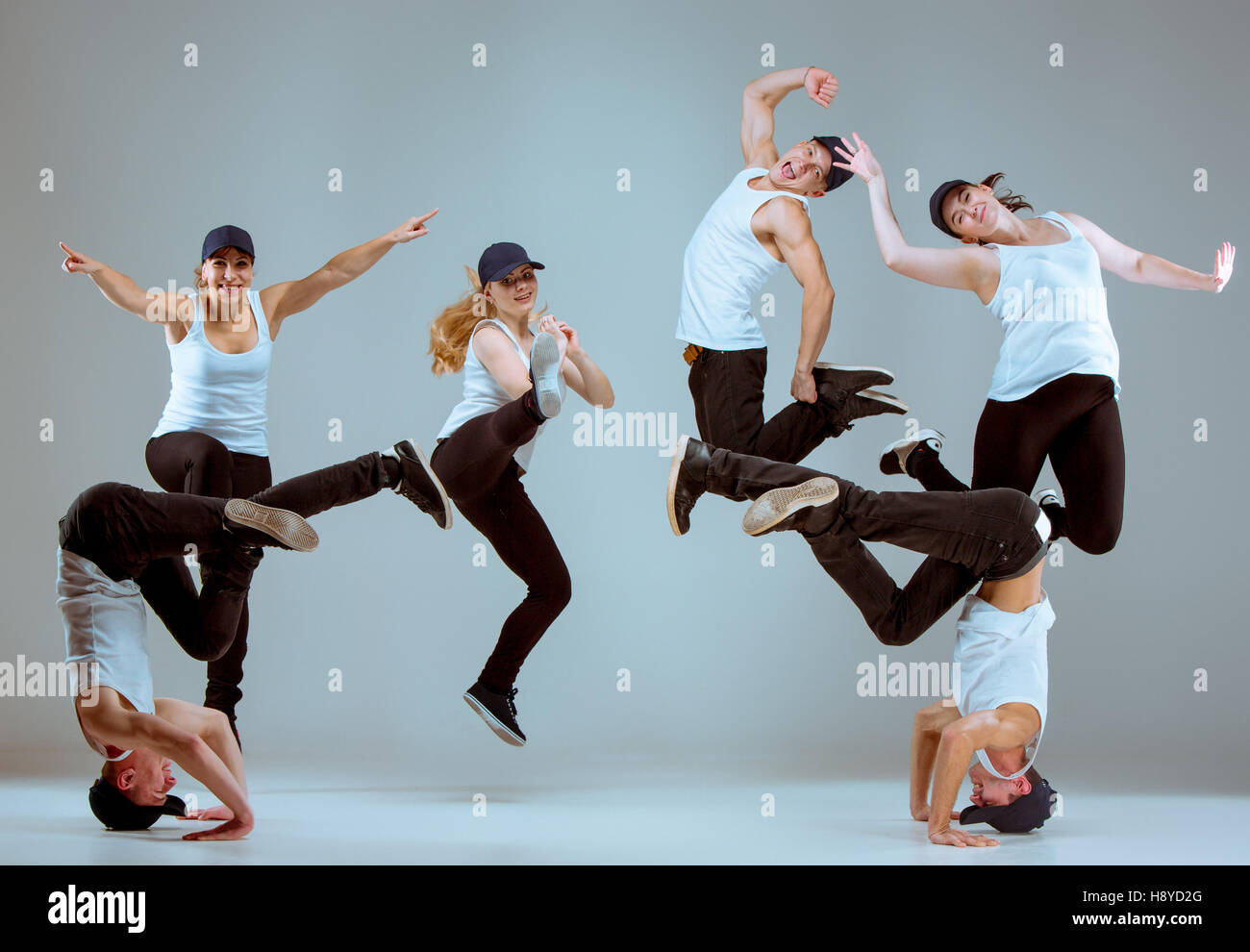Group of men and women dancing hip hop choreography Stock Photo - Alamy