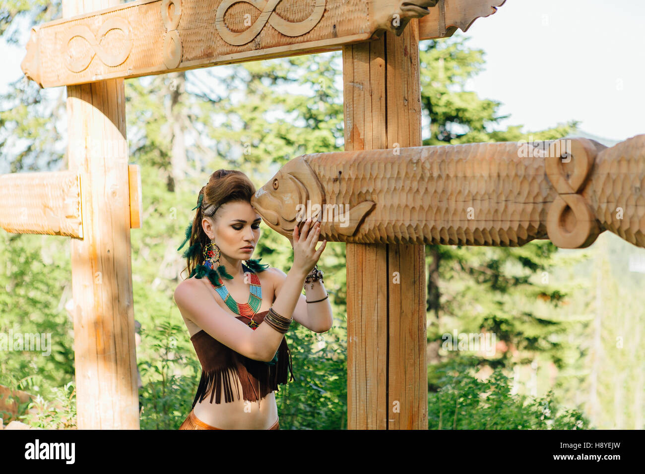 Young and beautiful savage girl in forest Stock Photo - Alamy