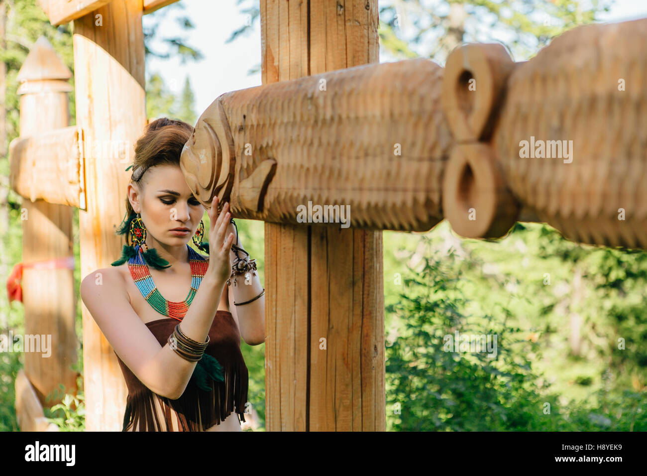 Young and beautiful savage girl in forest Stock Photo - Alamy