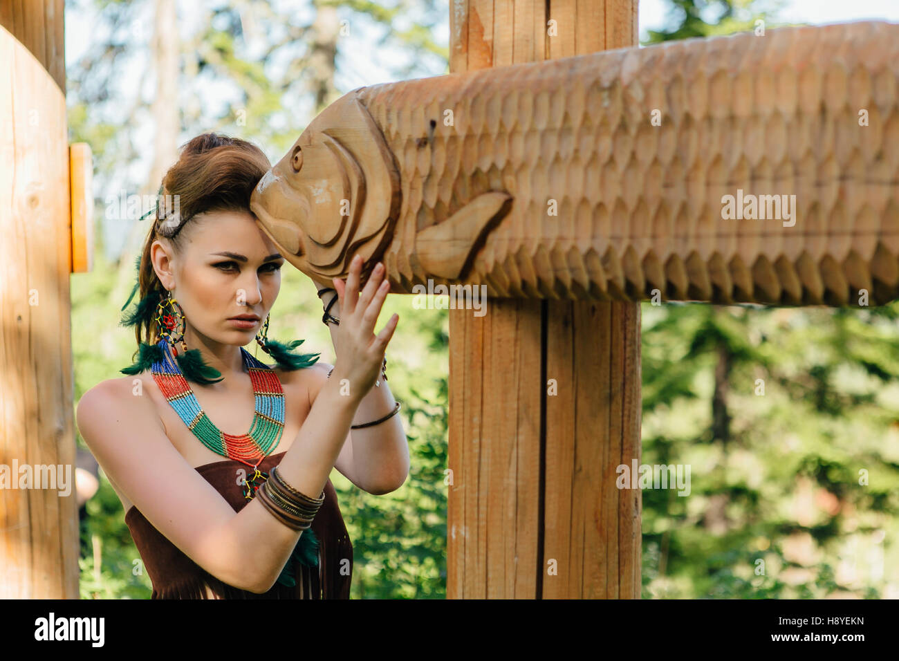 Young and beautiful savage girl in forest Stock Photo - Alamy