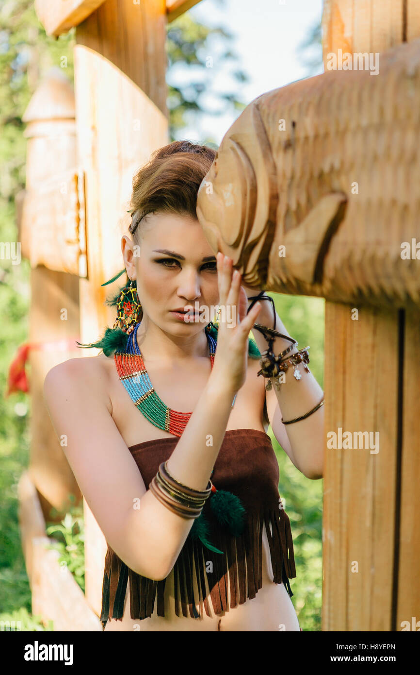 Young and beautiful savage girl in forest Stock Photo - Alamy