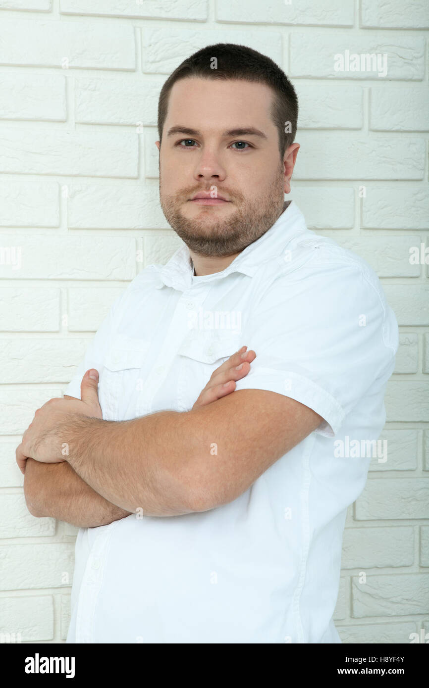 Portrait of a men in studio gray background Stock Photo - Alamy