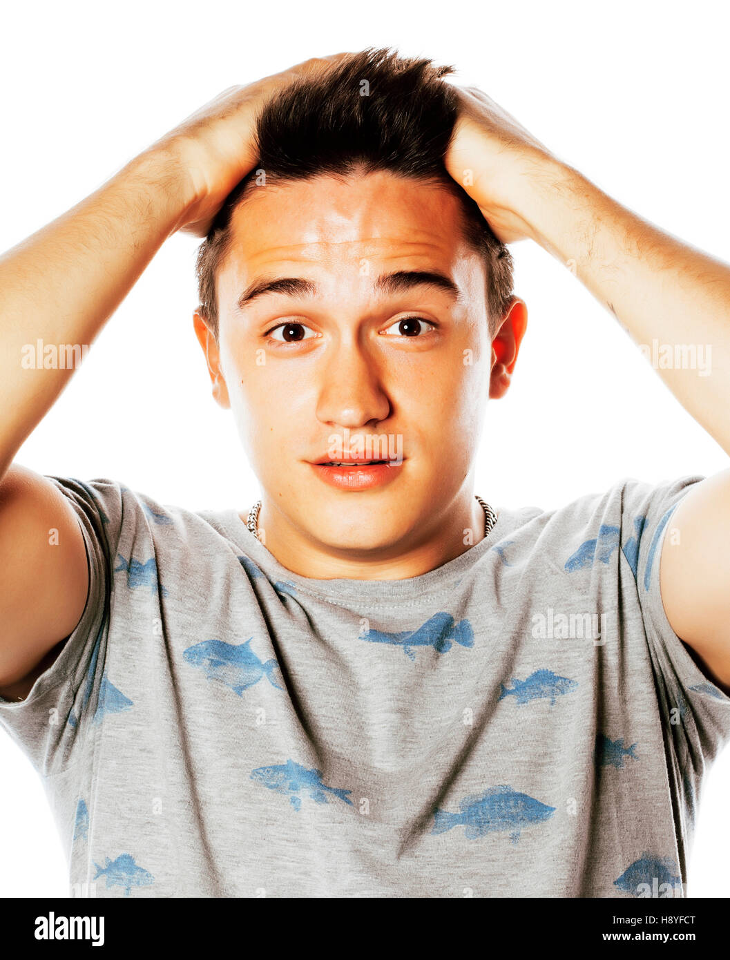 Young attractive handsome man holding hands on his head emotiona Stock ...