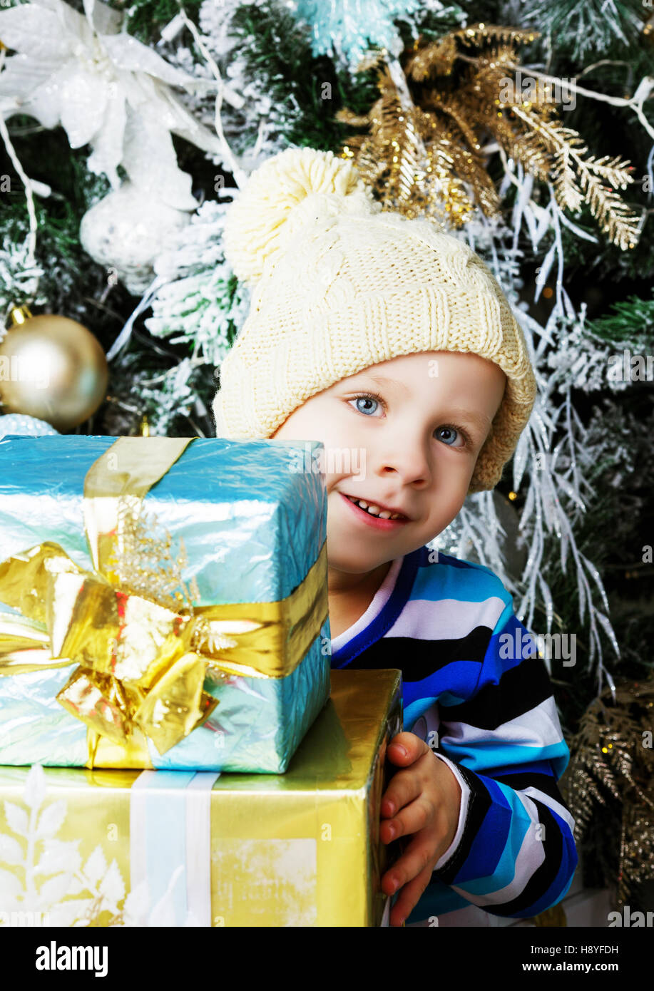happy child at home with Christmas tree and presents Stock Photo - Alamy
