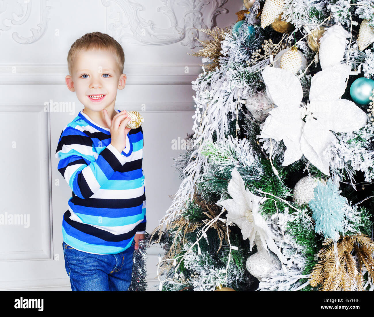 happy child at home with Christmas tree and presents Stock Photo - Alamy