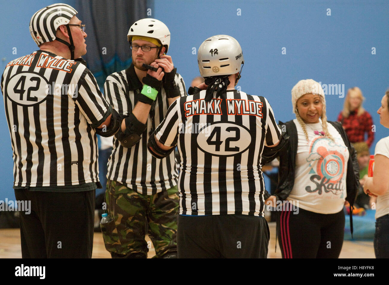 Two roller derby referees wearing the same jersey/top Stock Photo - Alamy