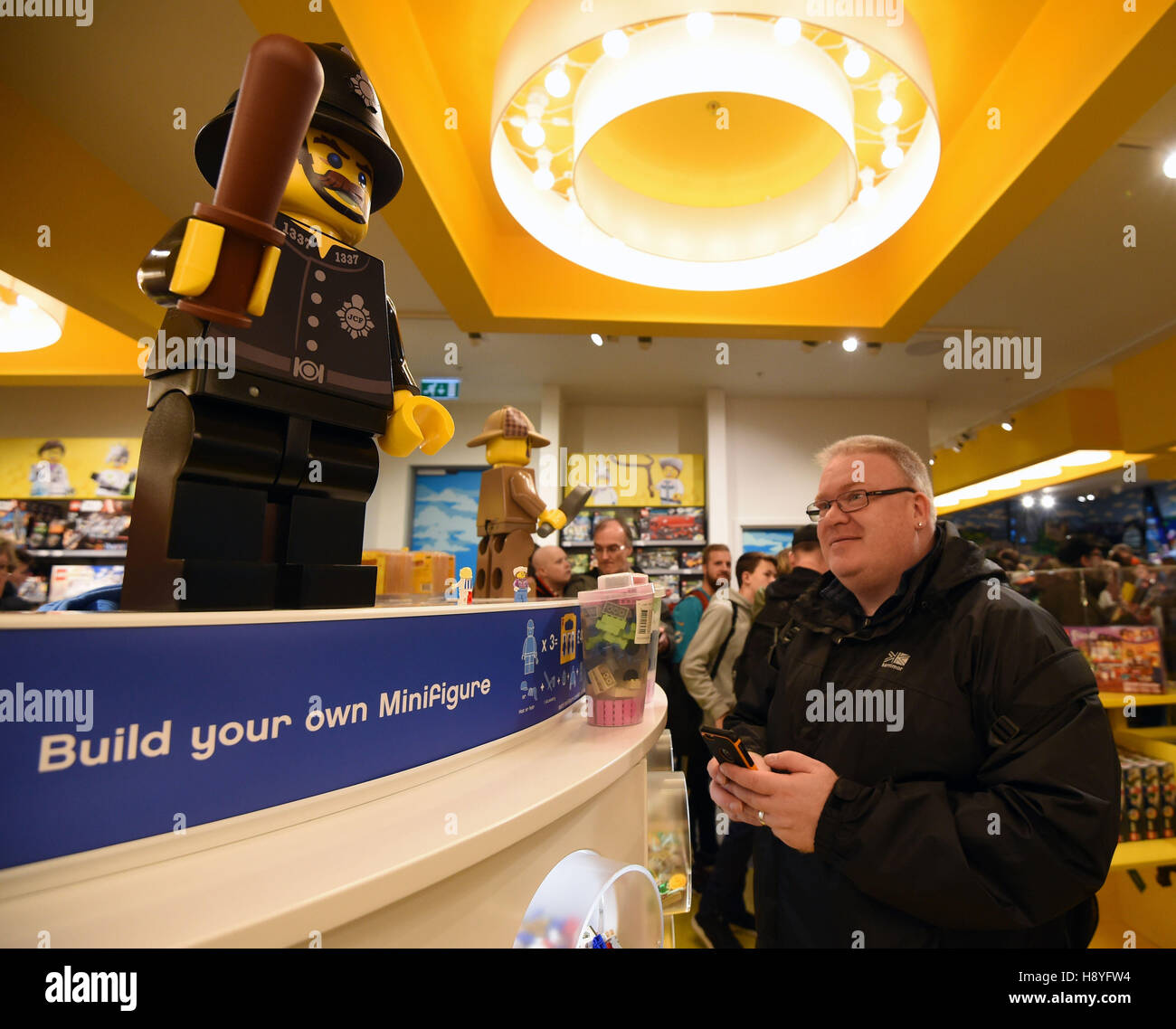 A man views a Lego policeman inside the 'world's largest Lego store' in ...
