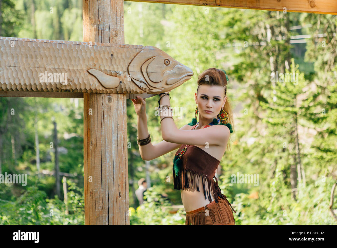 Young and beautiful savage girl in forest Stock Photo - Alamy