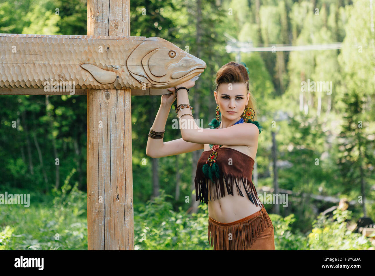 Young and beautiful savage girl in forest Stock Photo - Alamy