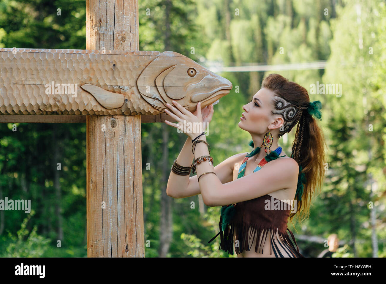 Young and beautiful savage girl in forest Stock Photo - Alamy