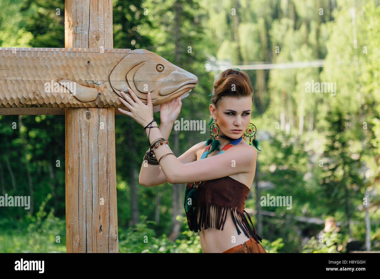 Young and beautiful savage girl in forest Stock Photo - Alamy