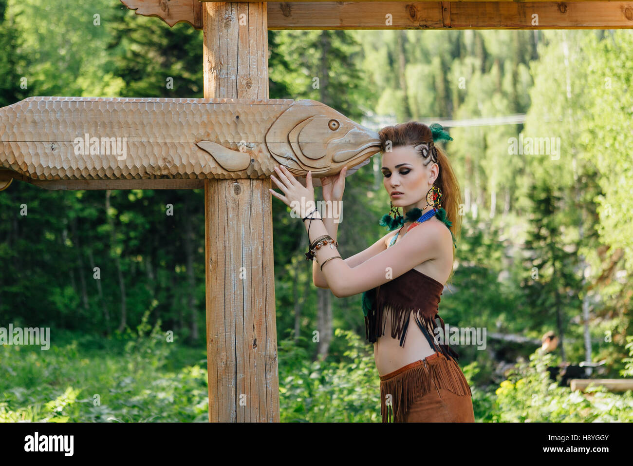 Young and beautiful savage girl in forest Stock Photo - Alamy
