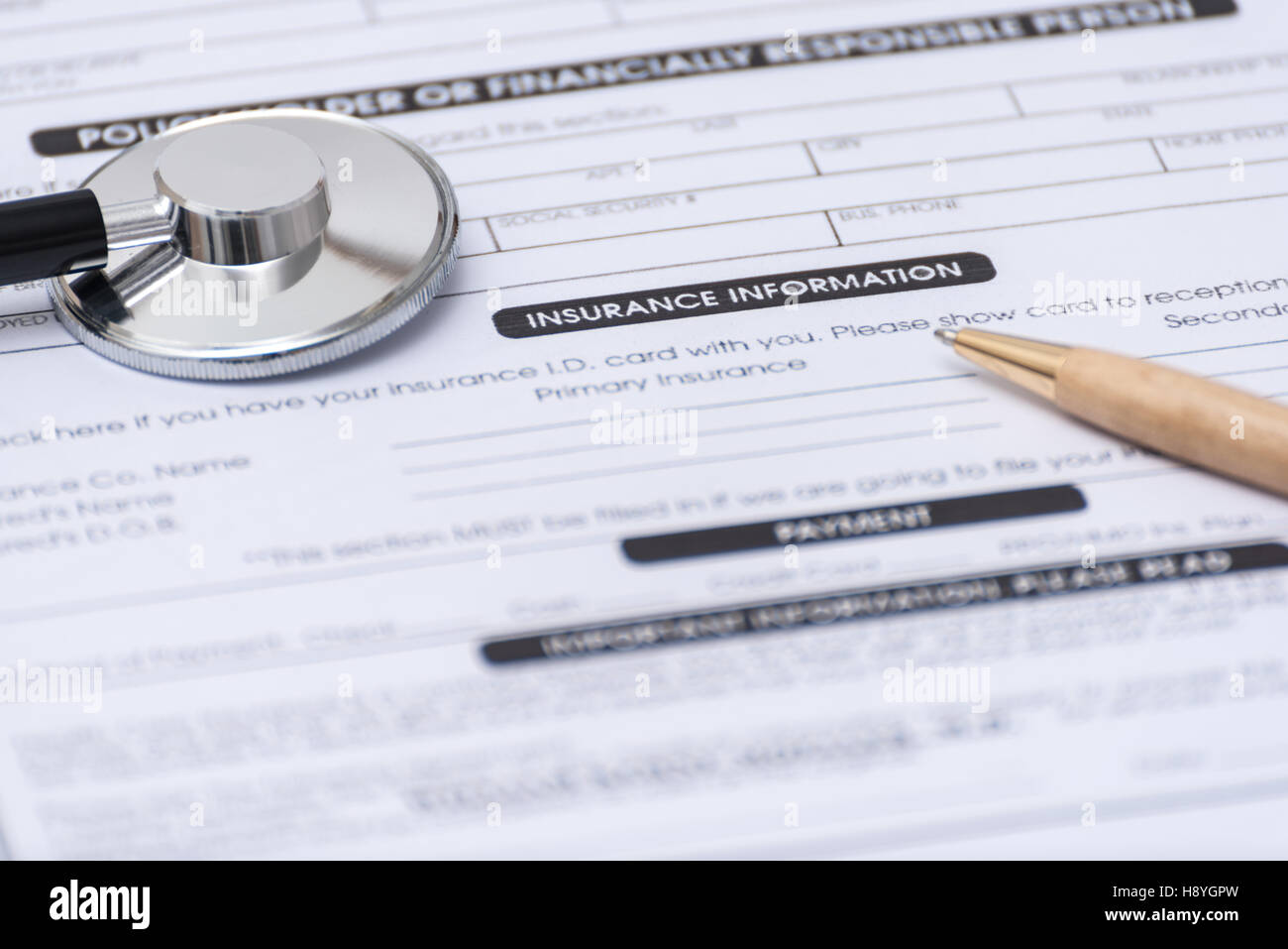Close-up of Health Insurance Claim Application Form with pen and ...