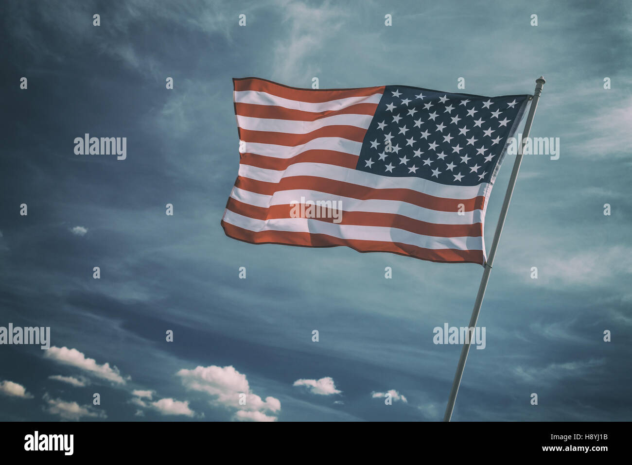 american flag on sky background Stock Photo - Alamy