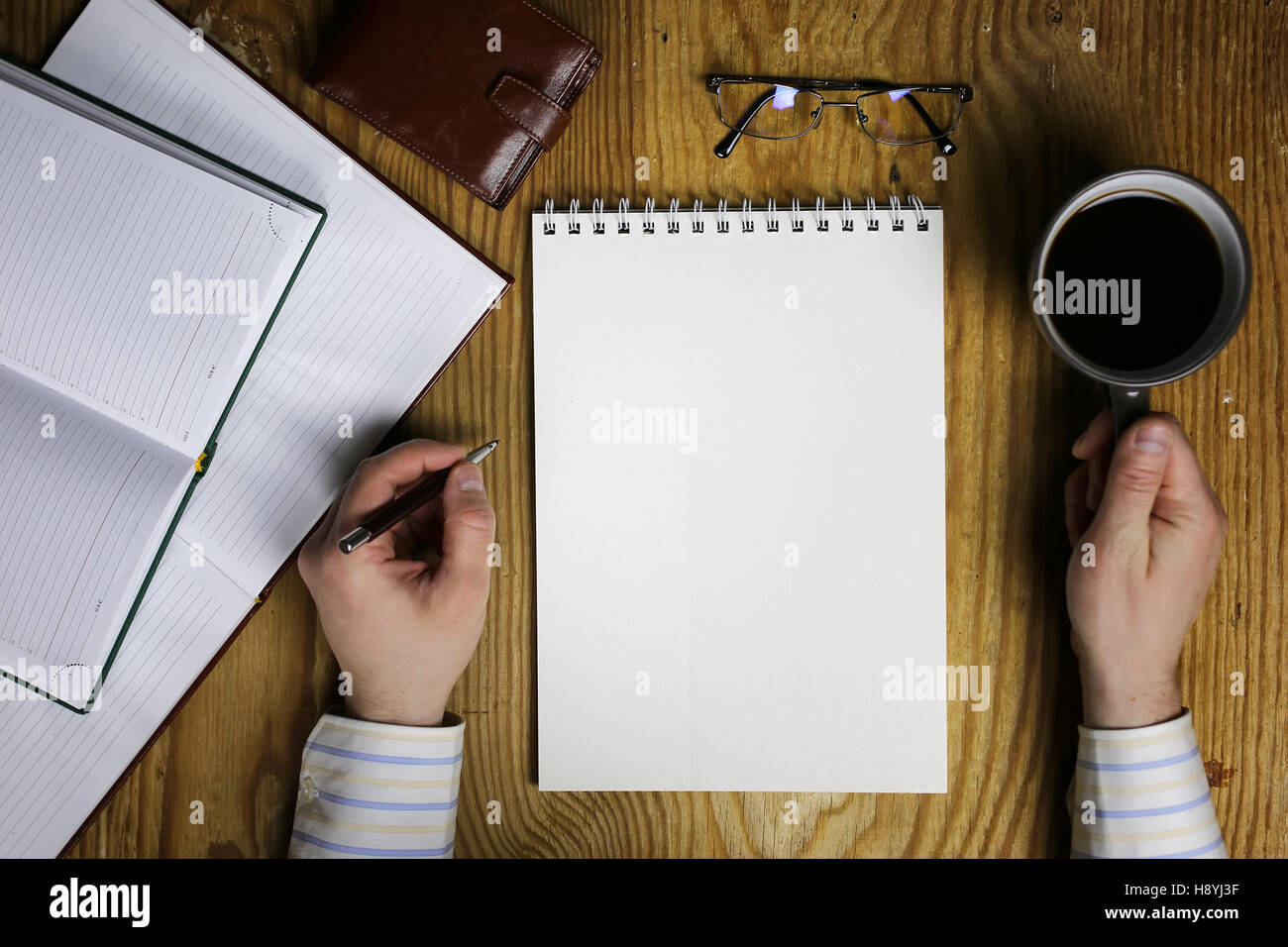 table write hand office view Stock Photo - Alamy