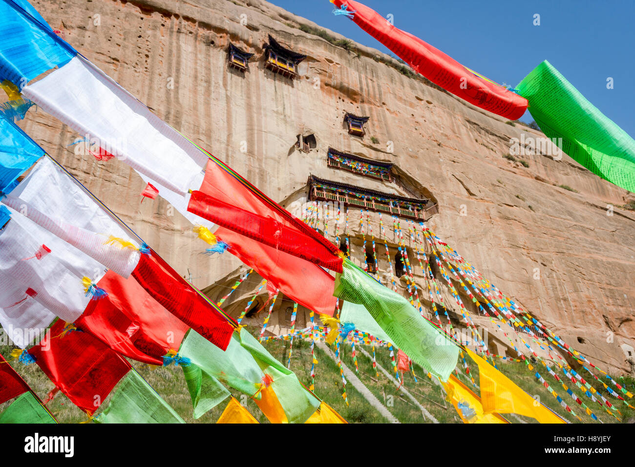 Mati Si cave temple with colorful praying buddhist flags, Zhangye ...
