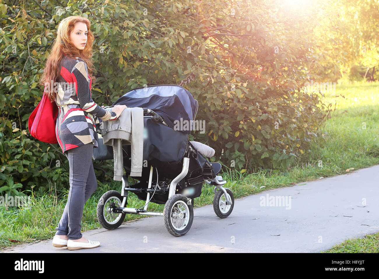 walk women with stroller summer sunlight Stock Photo - Alamy