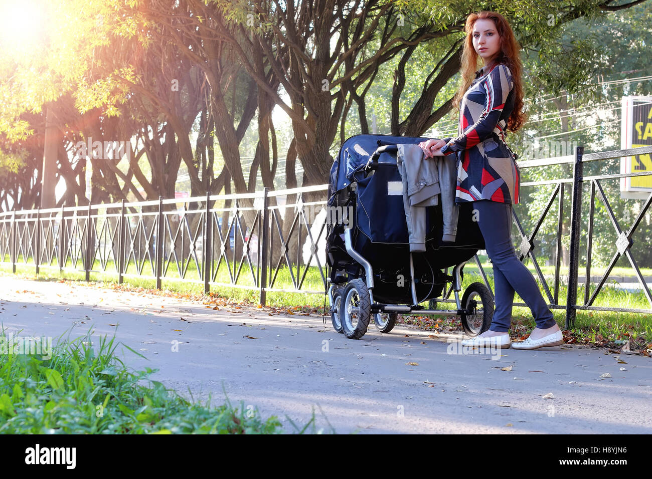 walk women with stroller summer sunlight Stock Photo - Alamy