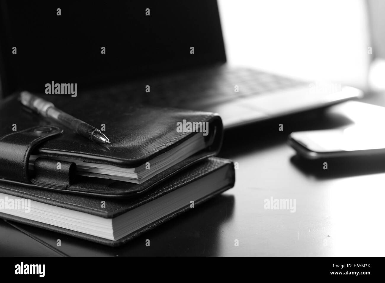 office desk with a computer and a telephone diary Stock Photo - Alamy
