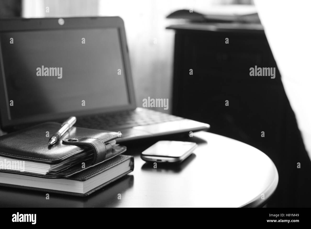 office desk with a computer and a telephone diary Stock Photo - Alamy