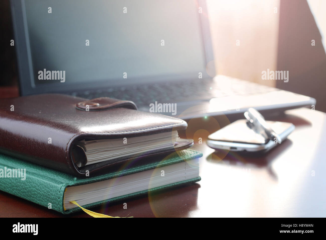 office desk with a computer and a telephone diary Stock Photo - Alamy