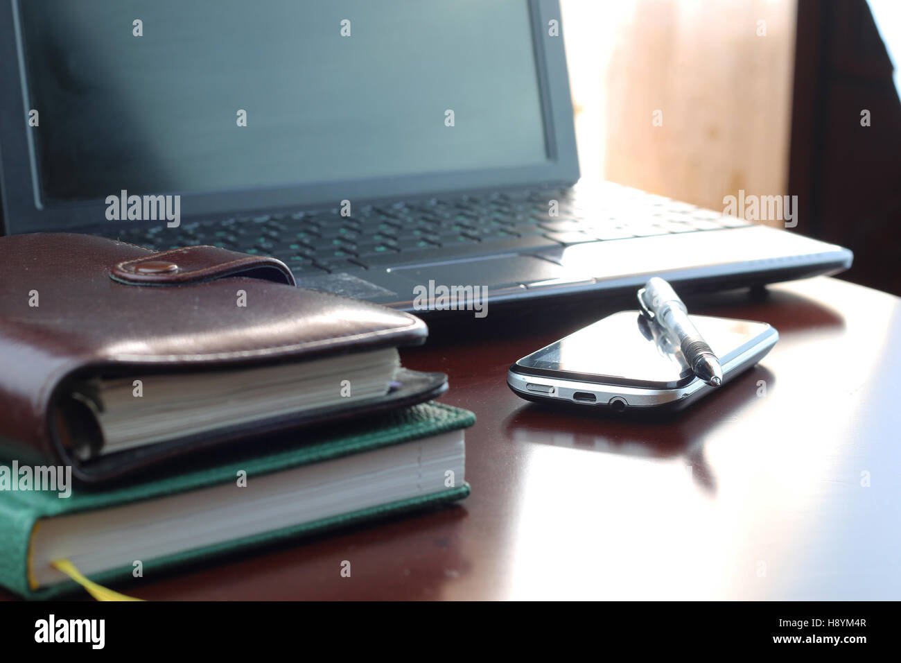 office desk with a computer and a telephone diary Stock Photo - Alamy