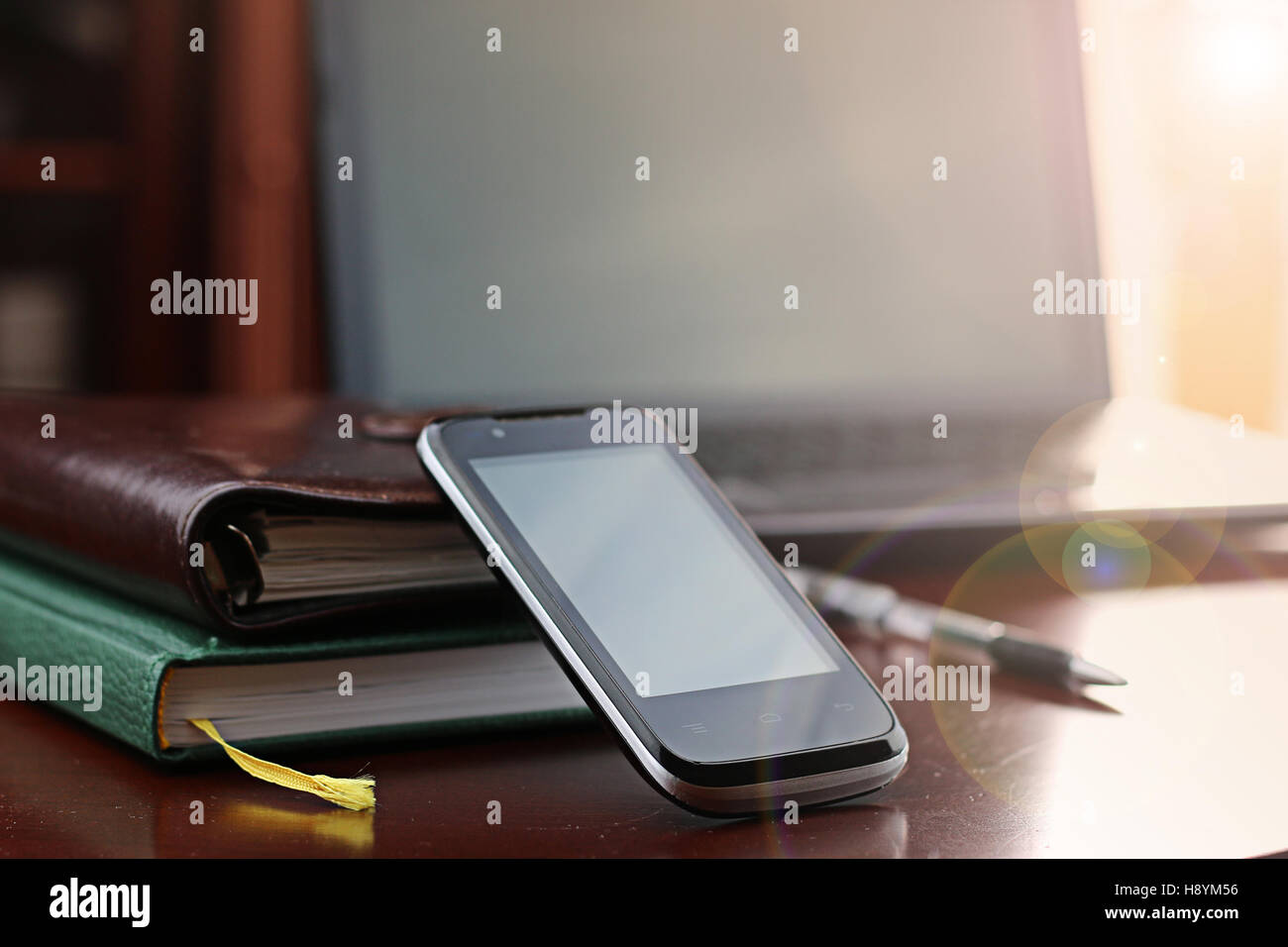 office desk with a computer and a telephone diary Stock Photo - Alamy
