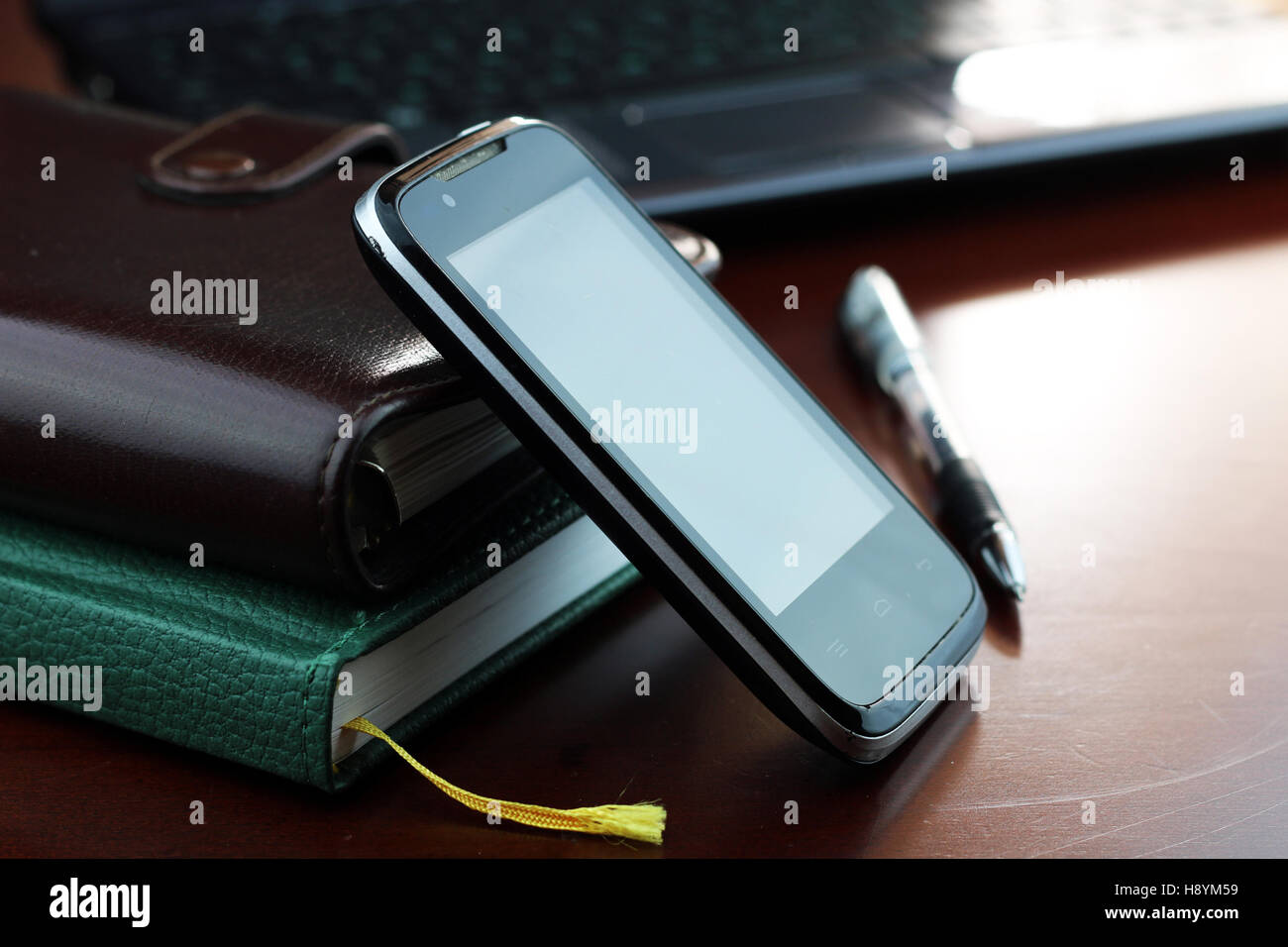 office desk with a computer and a telephone diary Stock Photo - Alamy