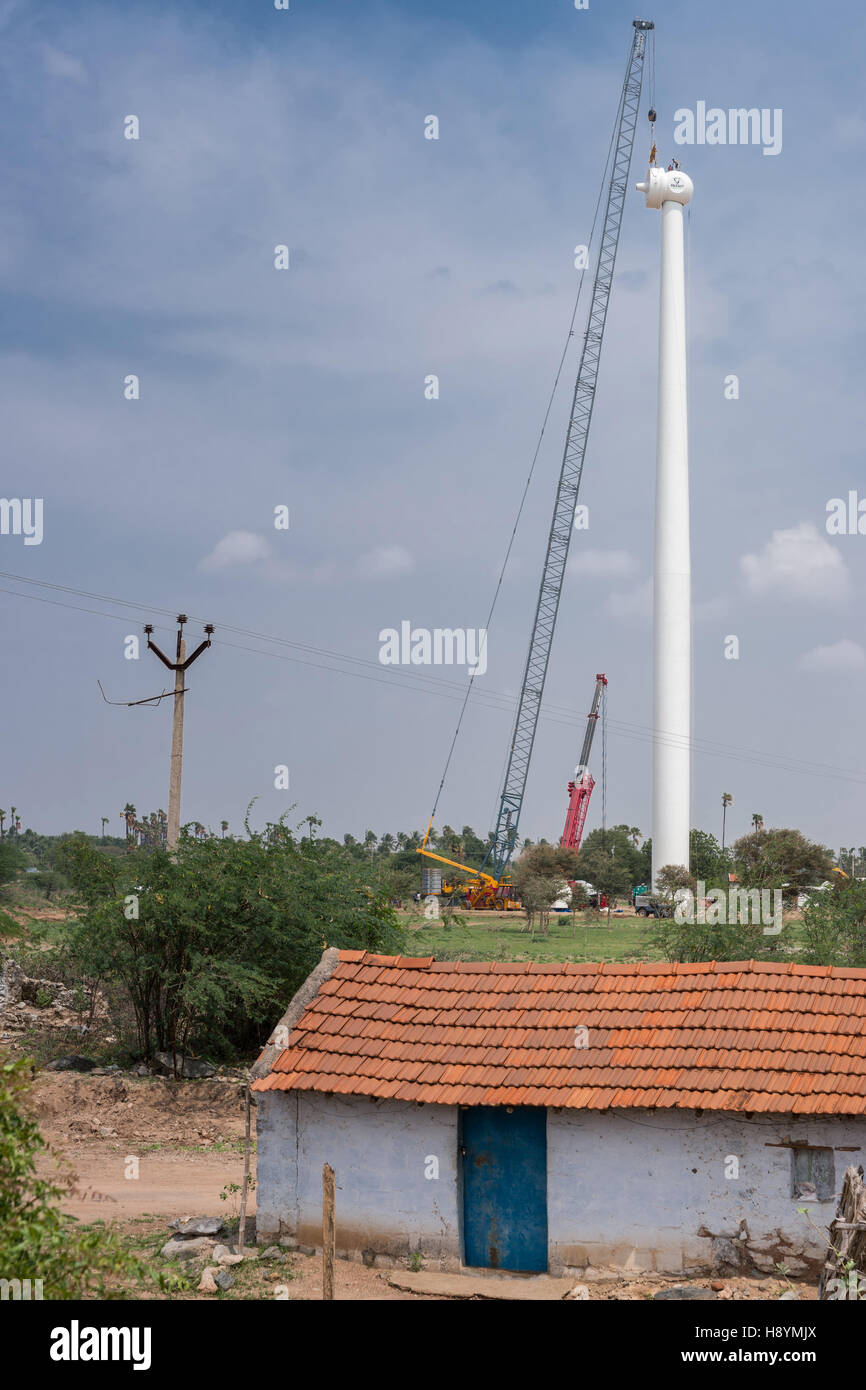 Very tall pole for modern windmill under construction Stock Photo - Alamy