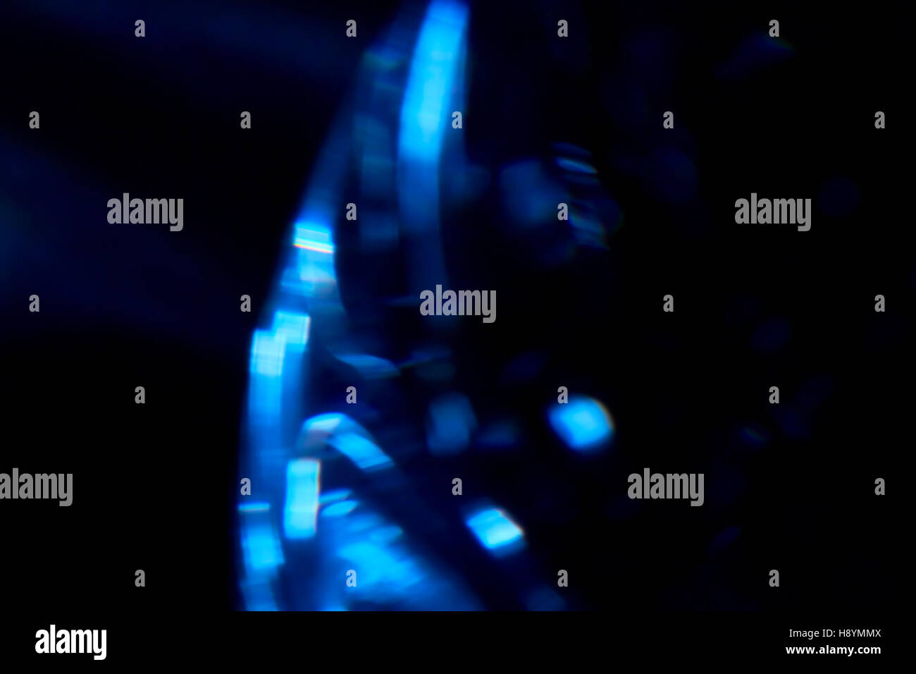 Blue overlay background of blue lights with bokeh effect. Includes copy ...