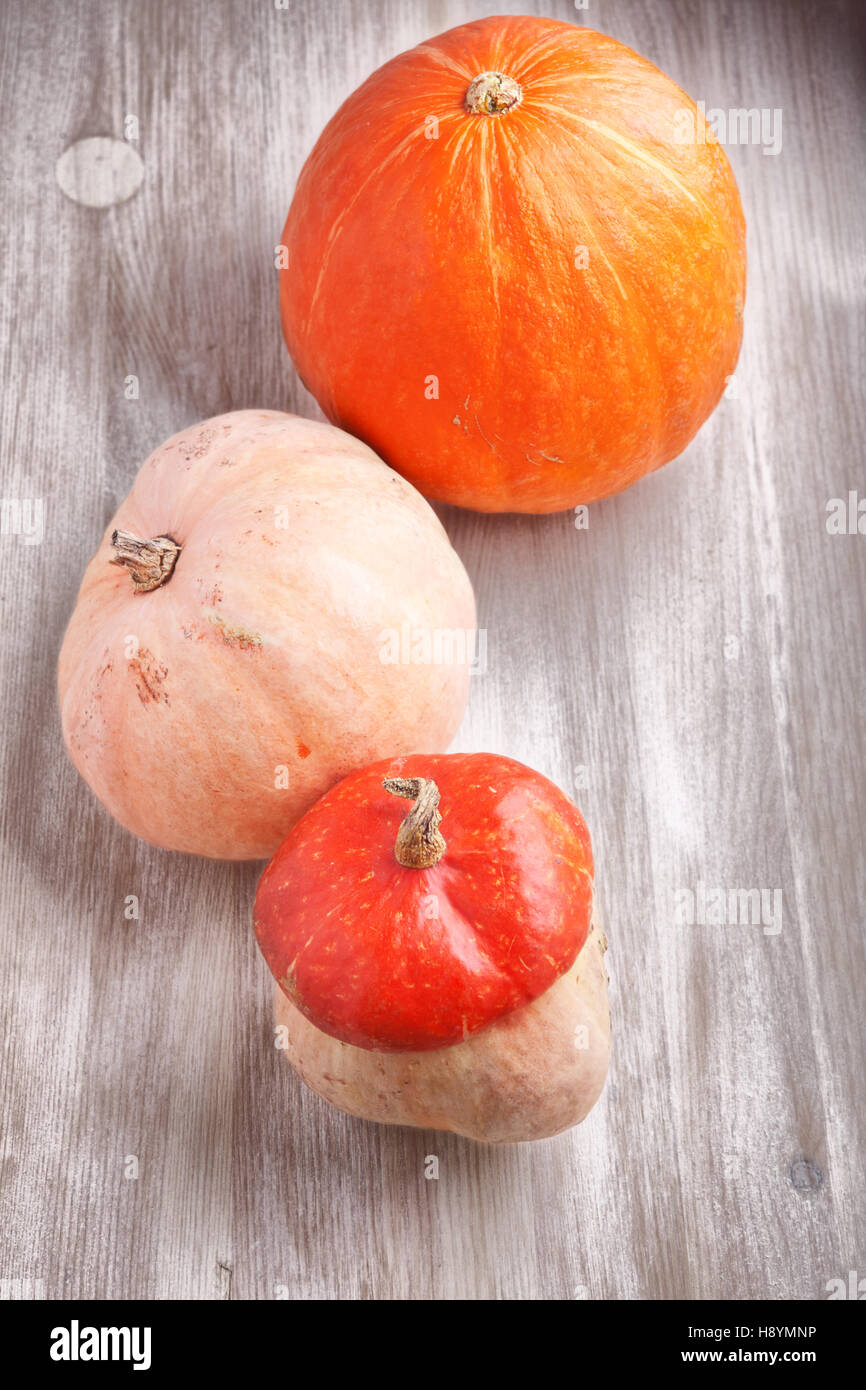 Pumpkins and turk's turban squash on wooden table Stock Photo - Alamy