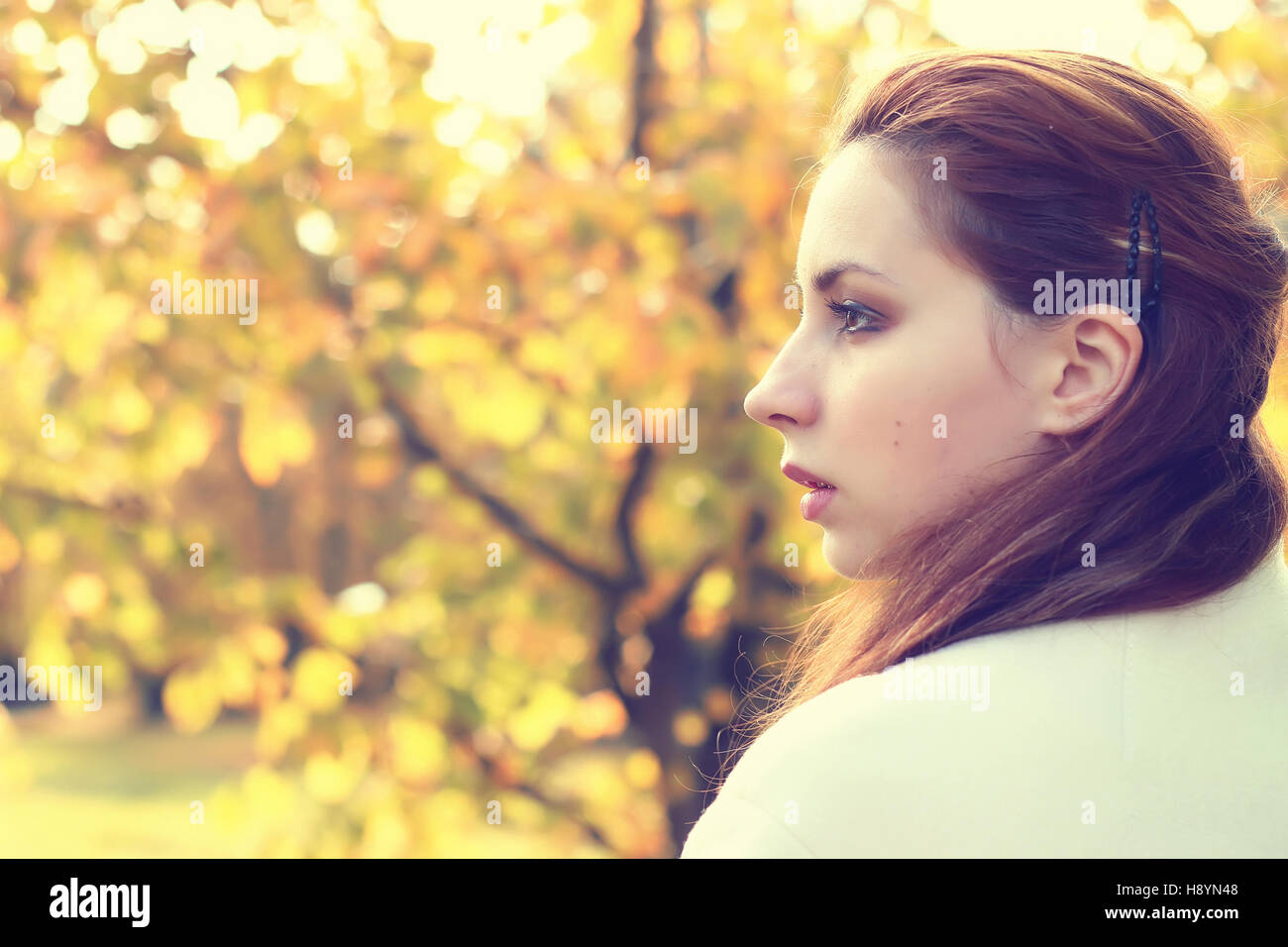girl in a park walk autumn alone Stock Photo - Alamy