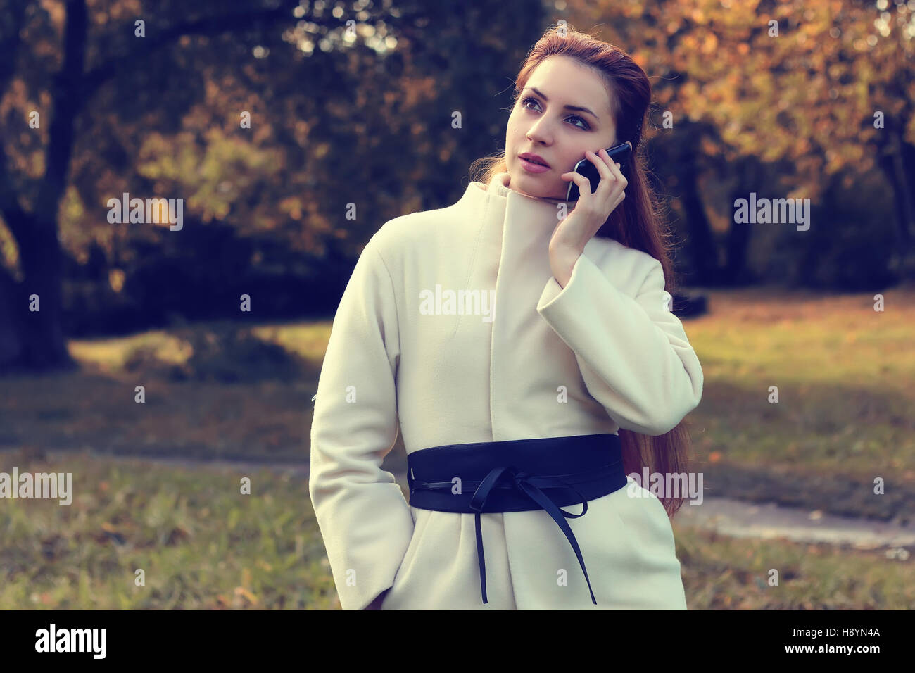 girl in a park walk autumn alone Stock Photo - Alamy