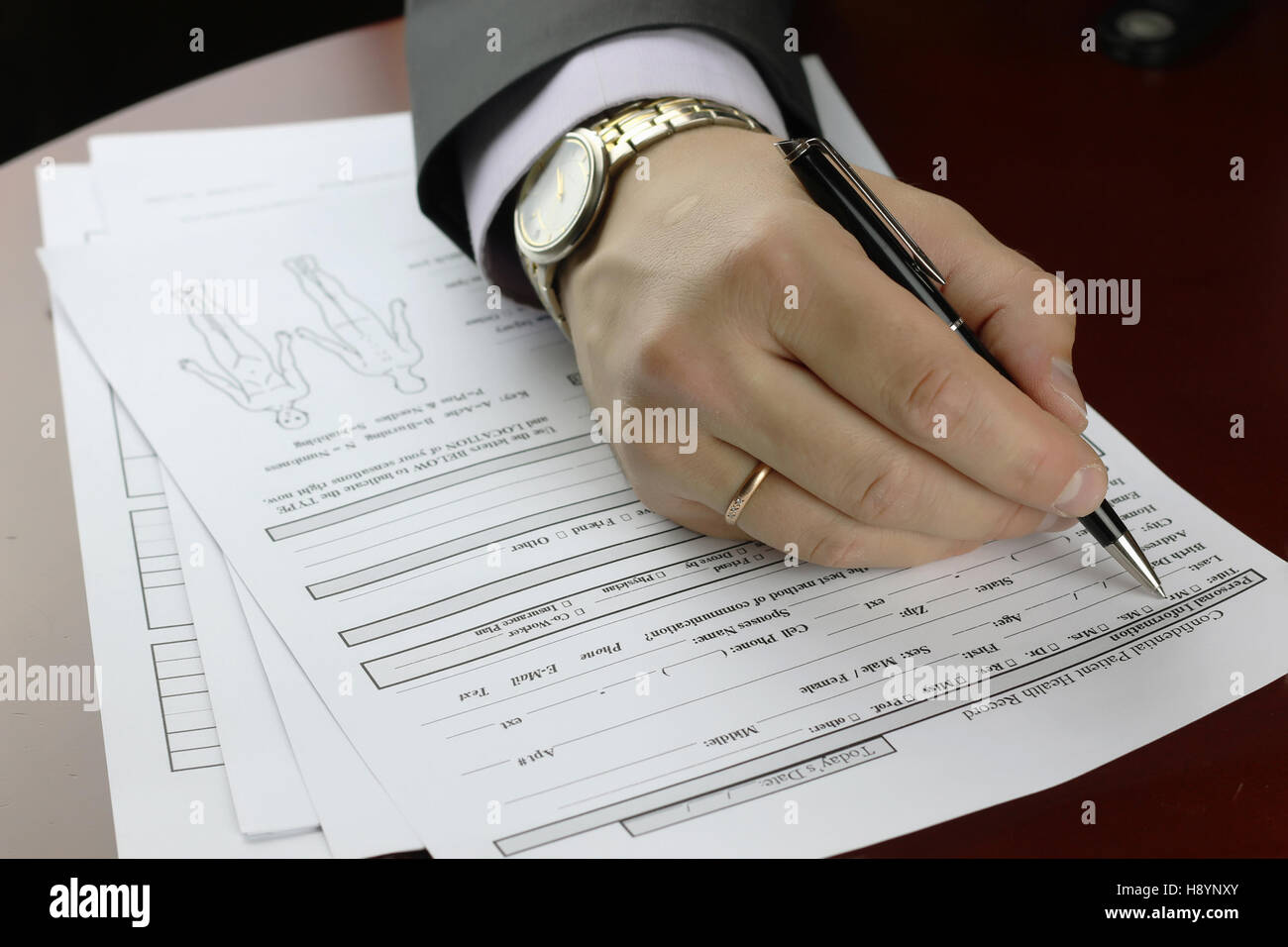 hand signed insurance Stock Photo - Alamy