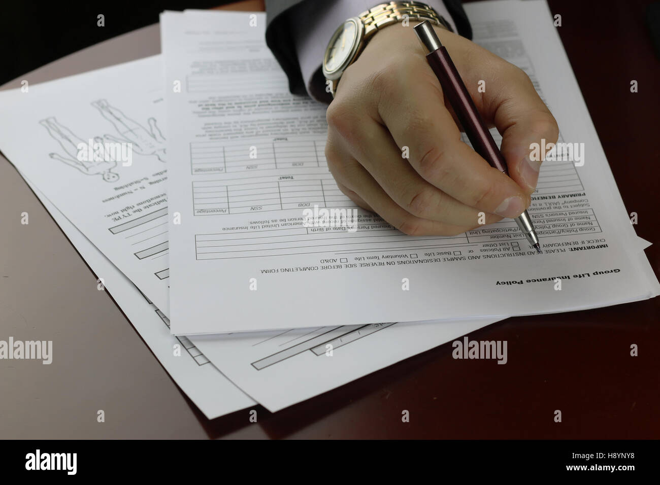 hand signed insurance Stock Photo - Alamy