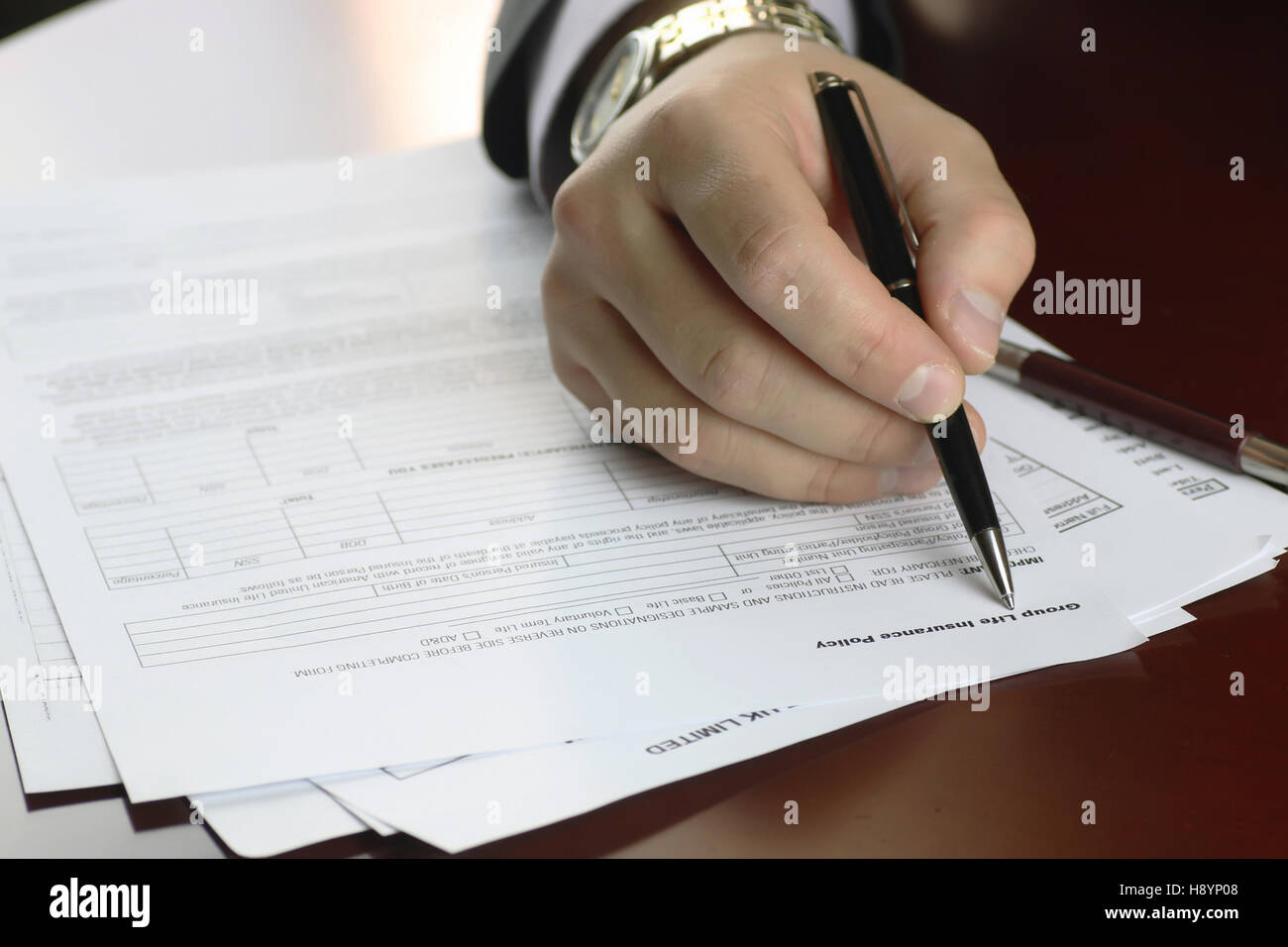 hand signed insurance Stock Photo - Alamy